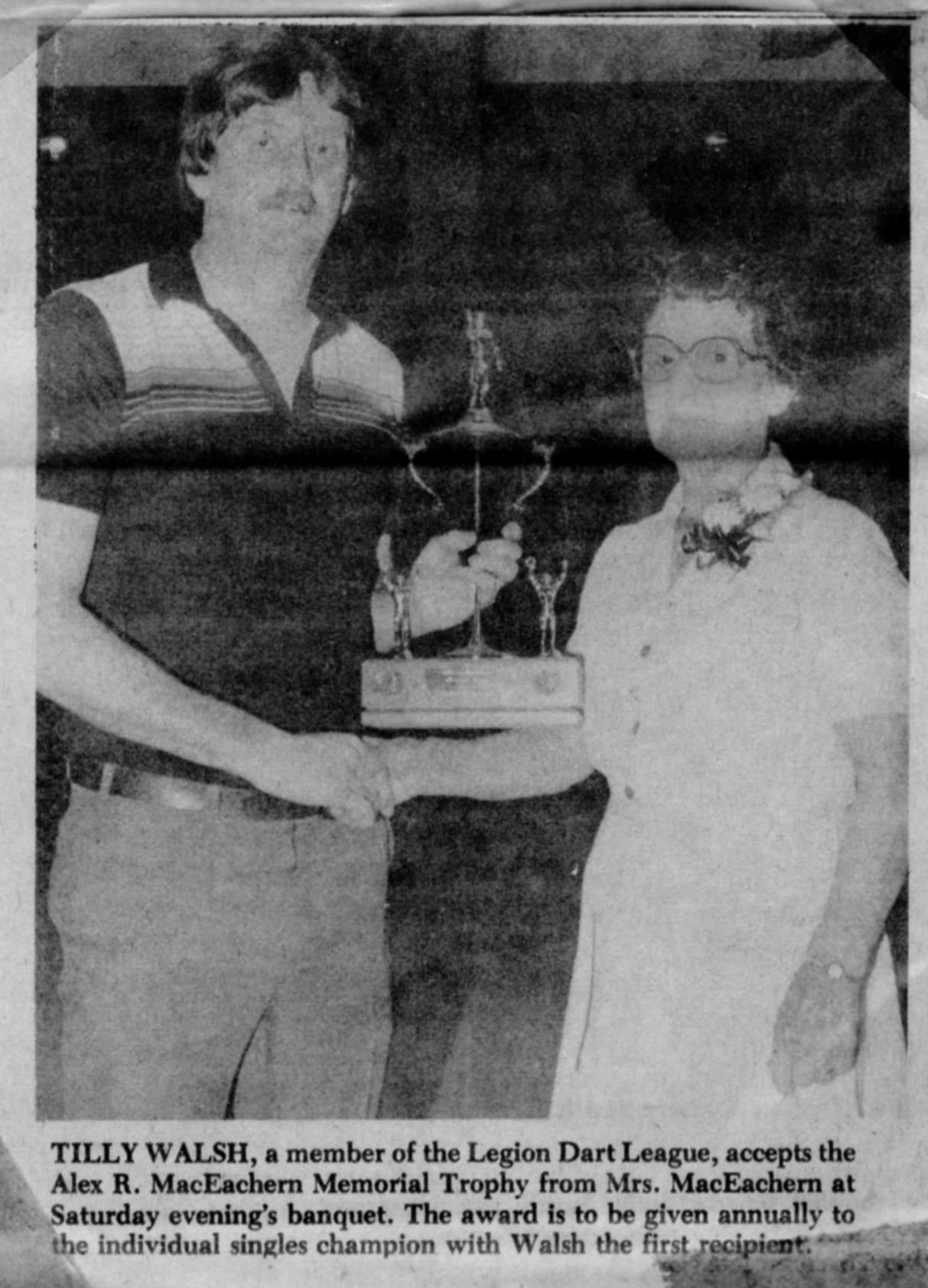 Newspaper - Unknown date. Photo of a man being presented a trophy ...